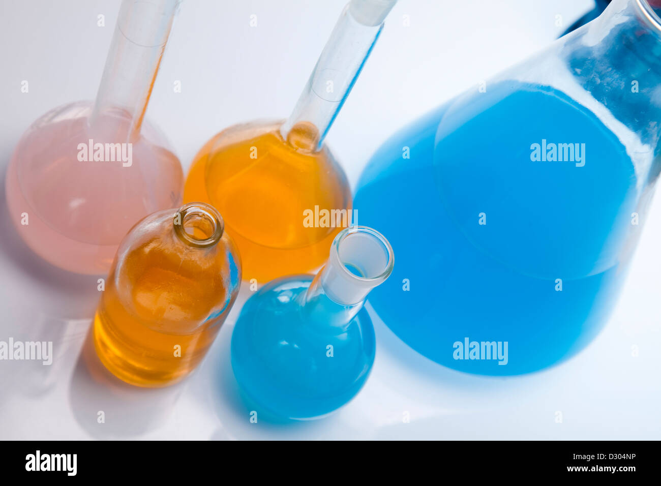 Laboratory flasks containing liquid color Stock Photo - Alamy
