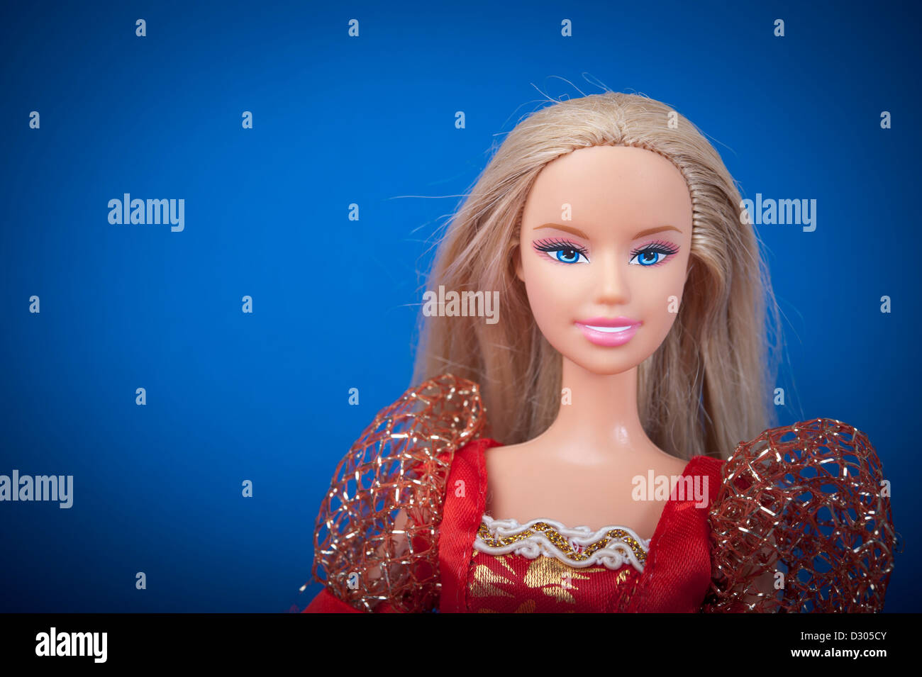 head and shoulder of a Barbie doll in red dress Stock Photo - Alamy