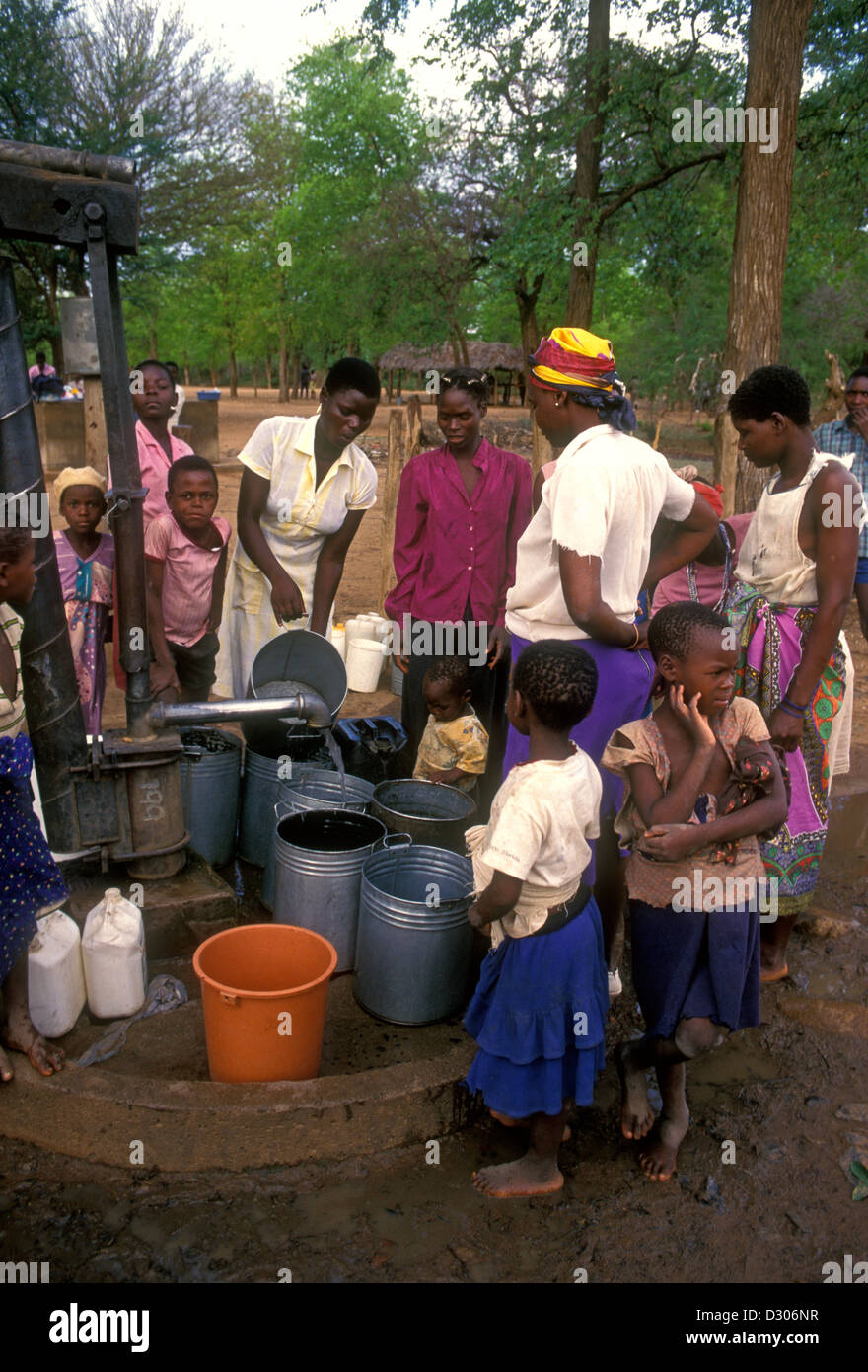 Zimbabwean people, women and children, pumping water from well, water ...