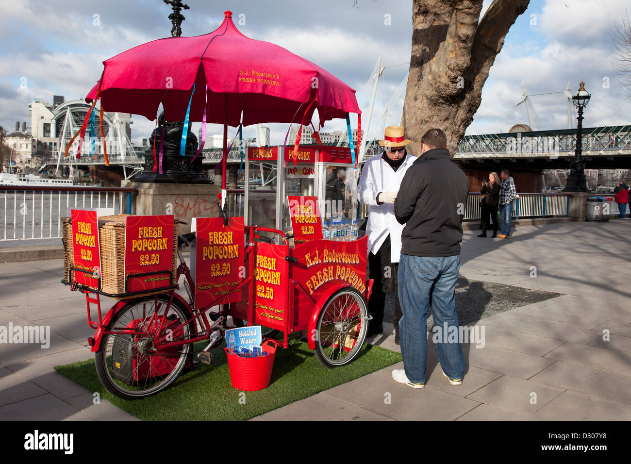 A walk along the River Thames on the Southbank in London. A popcorn ...