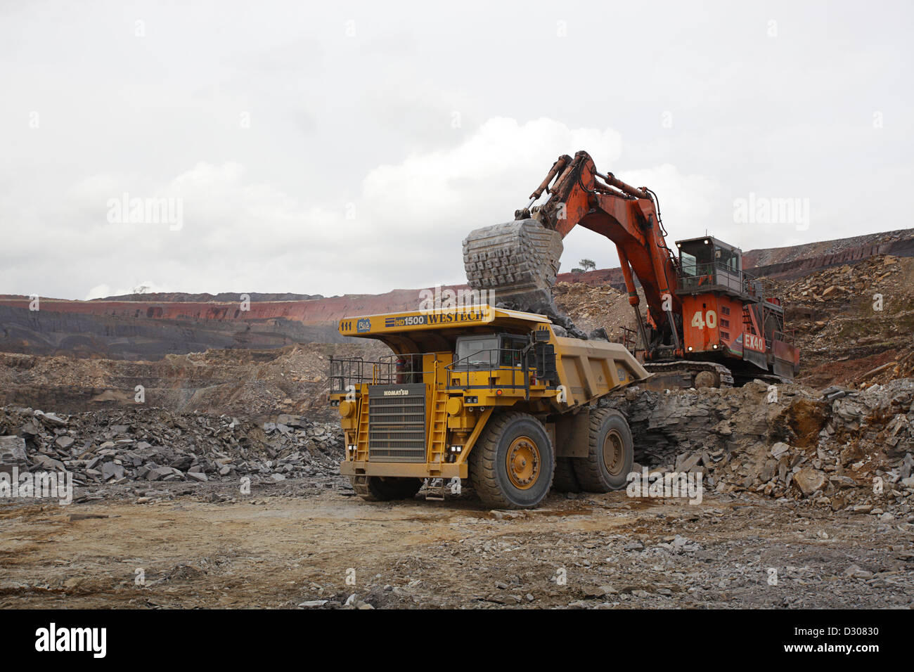 FQM mining excavator and large haul truck Stock Photo - Alamy