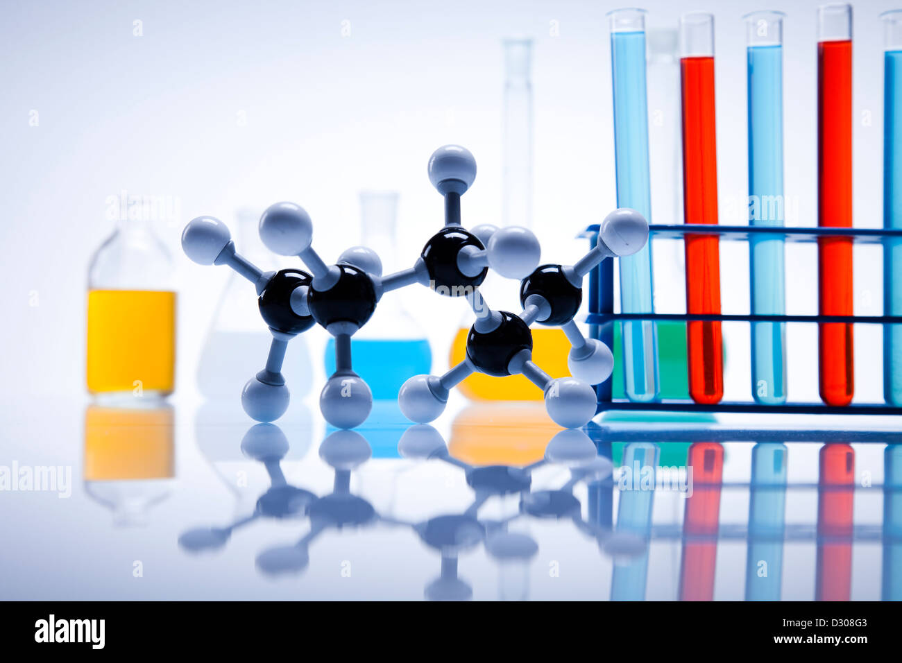Molecular model and flasks in laboratory Stock Photo - Alamy