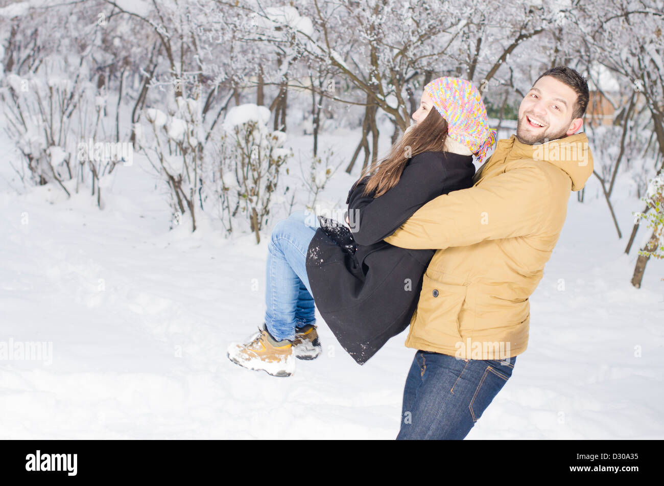 A nice couple playing in the snow Stock Photo - Alamy