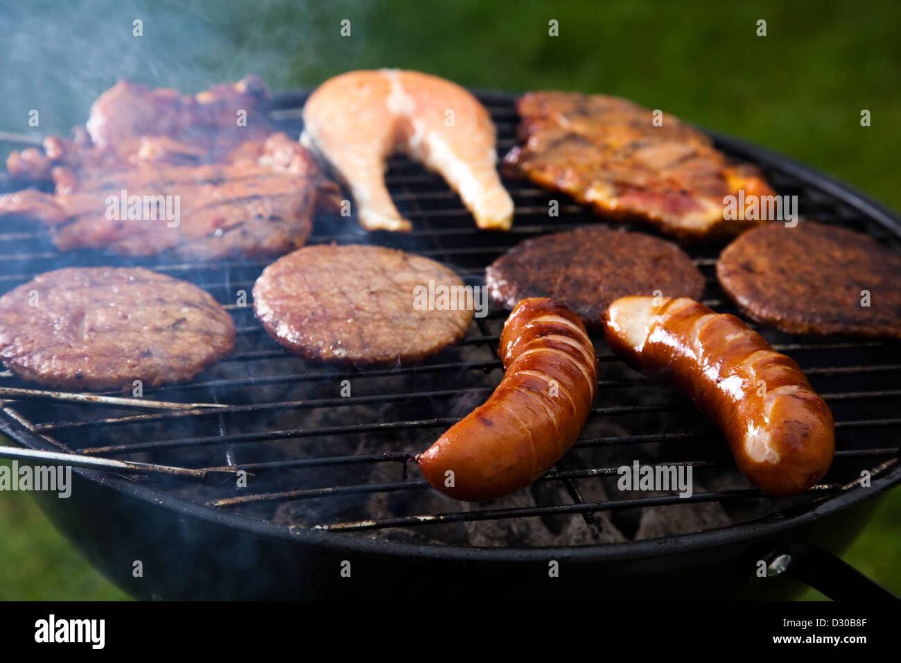 Cooking on the barbecue grill Stock Photo - Alamy
