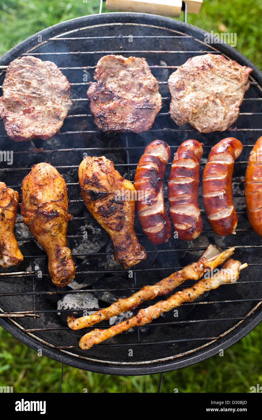 Cooking on the barbecue grill Stock Photo - Alamy