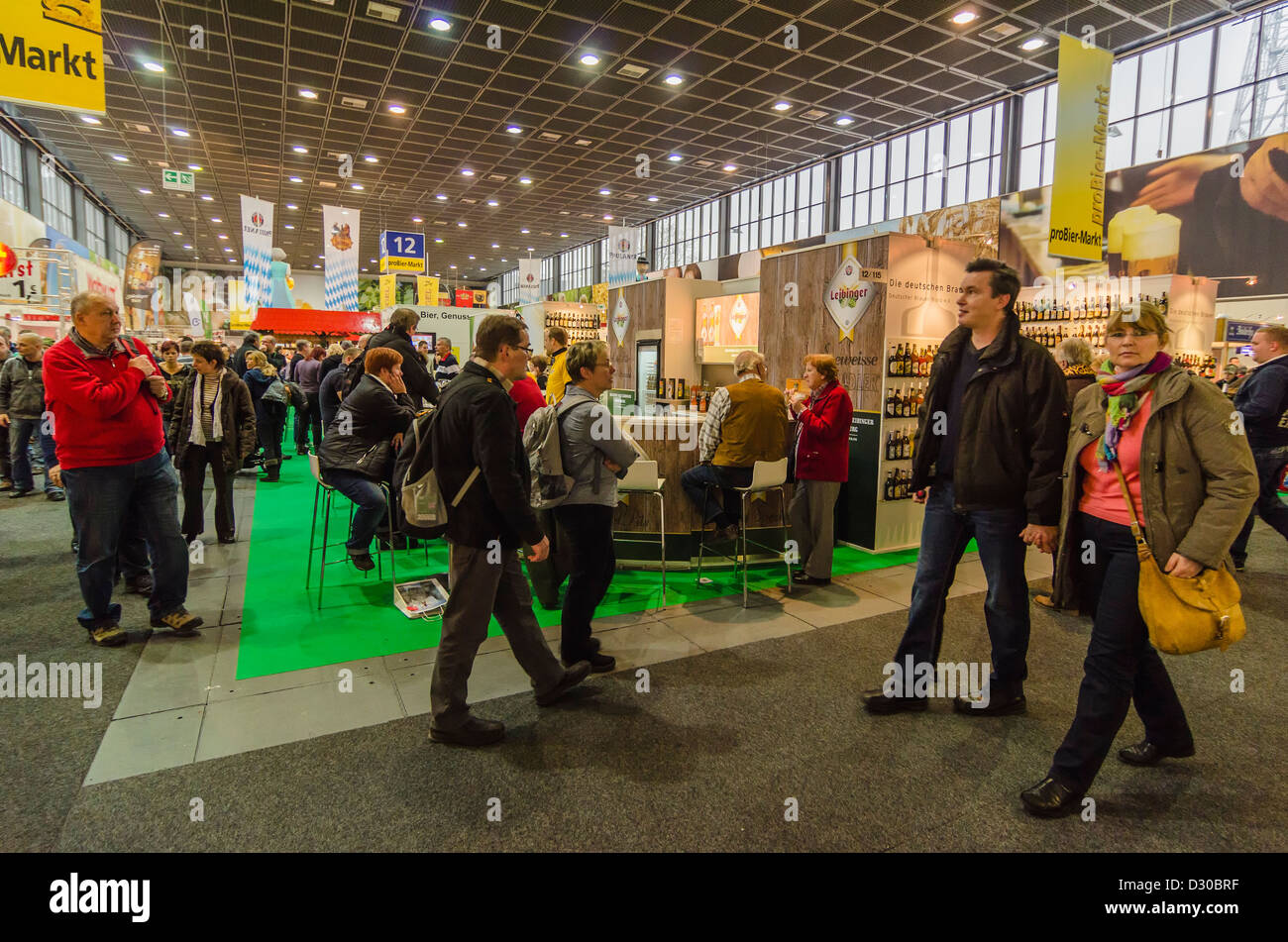 Visitors walking through exhibition hall at "Green Week" in Berlin ...