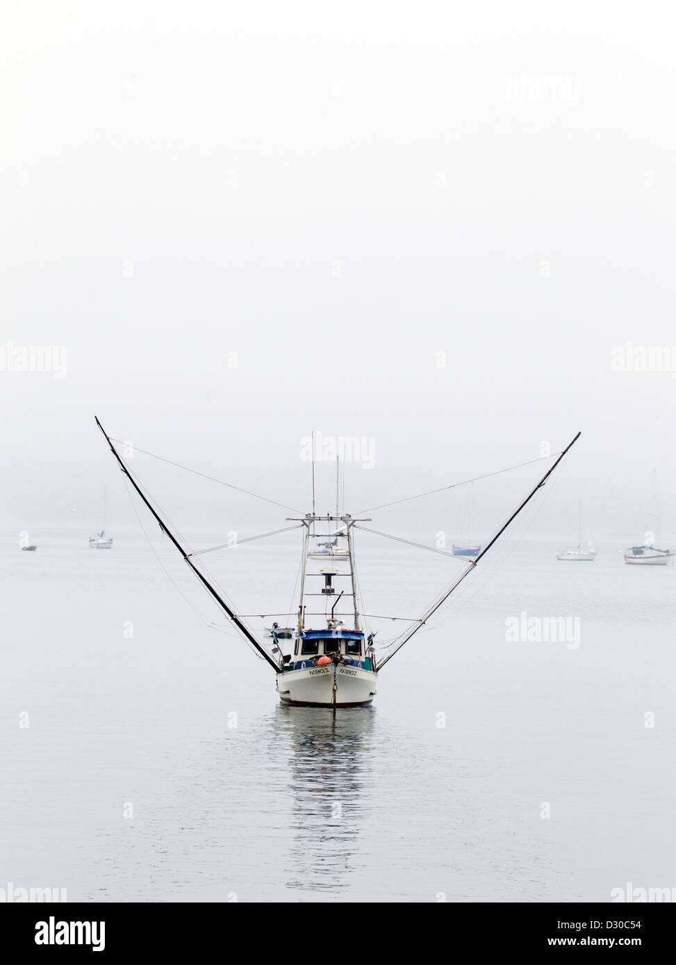 Fishing boat moored offshore in fog hi-res stock photography and images ...