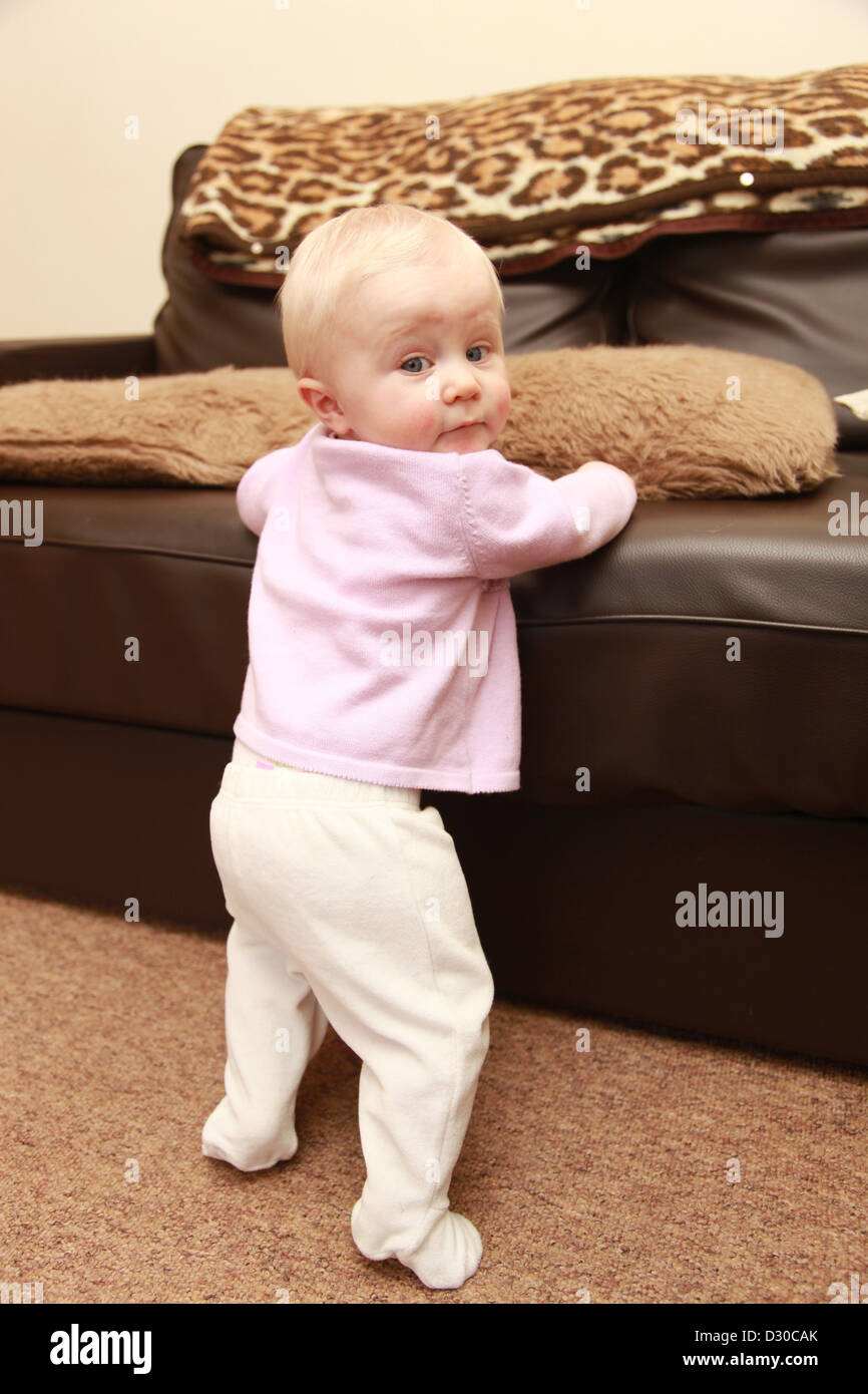 Child learning to stand and walk hi-res stock photography and images ...
