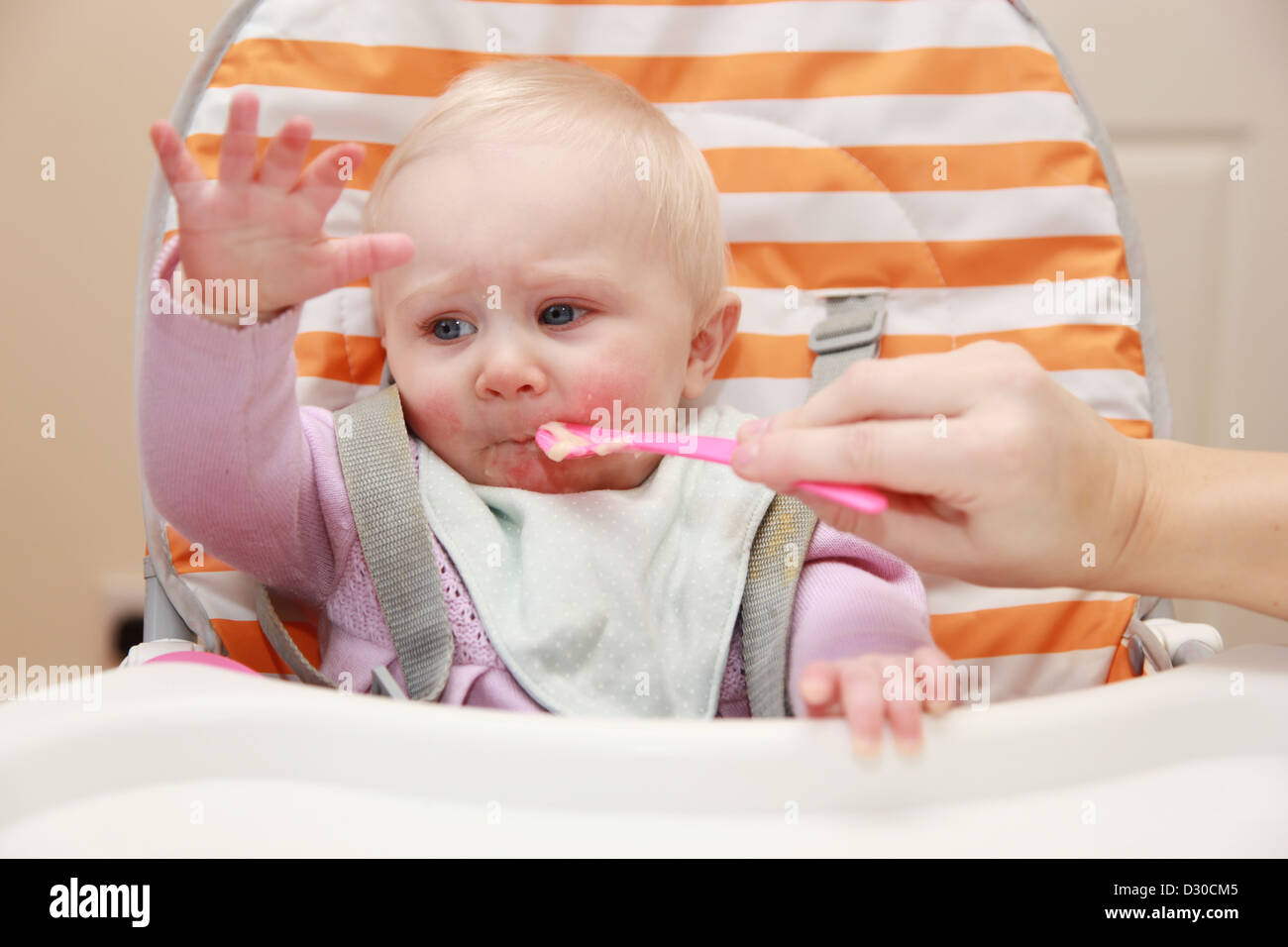 Baby refusing to eat Stock Photo - Alamy