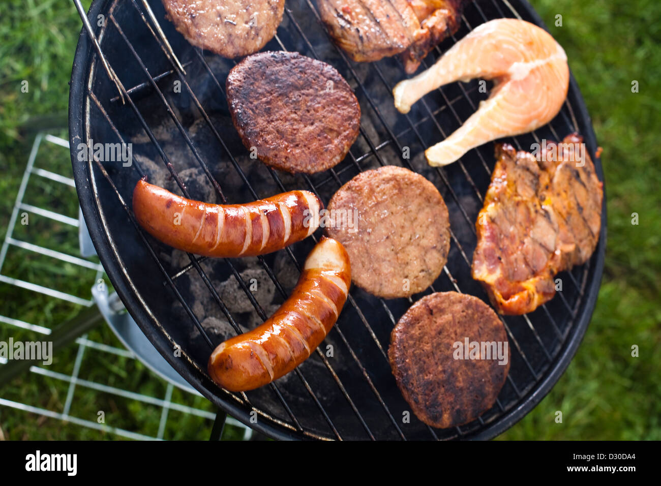 Cooking on the barbecue grill Stock Photo - Alamy