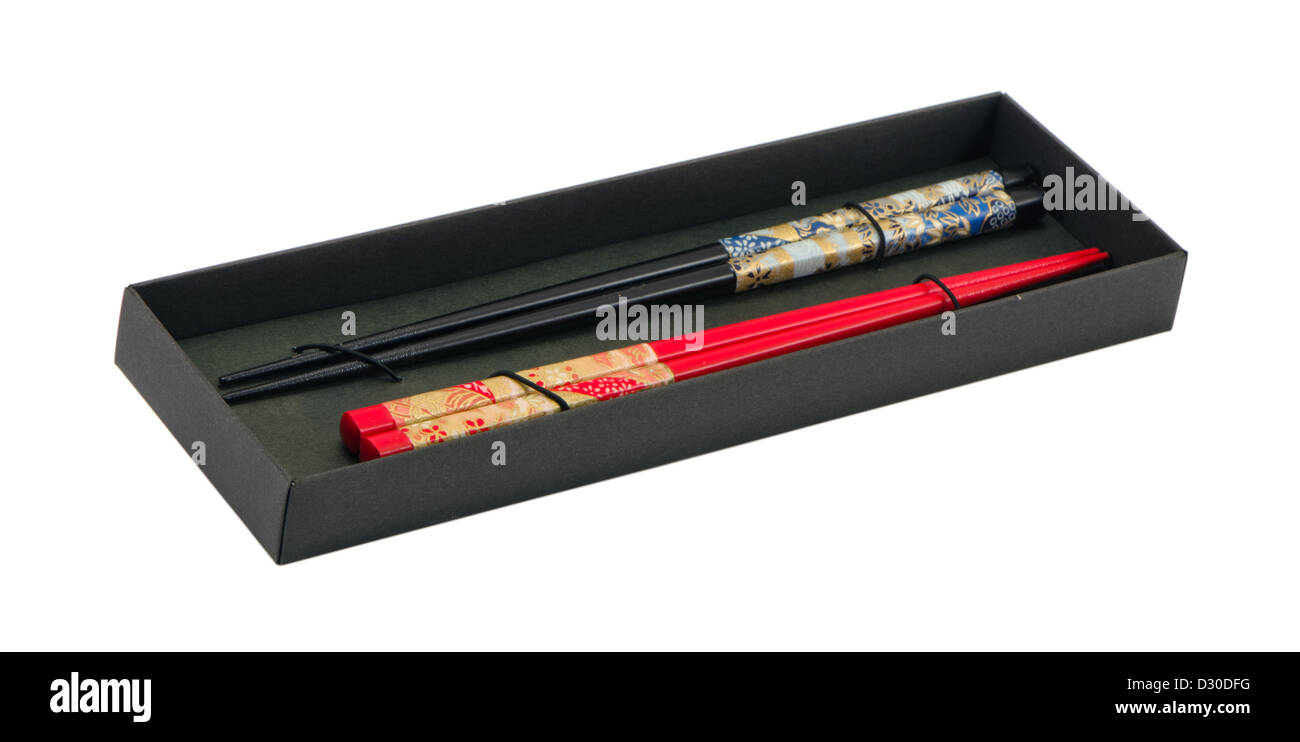 two pair of chinese wooden eating stick tools in box isolated on white ...