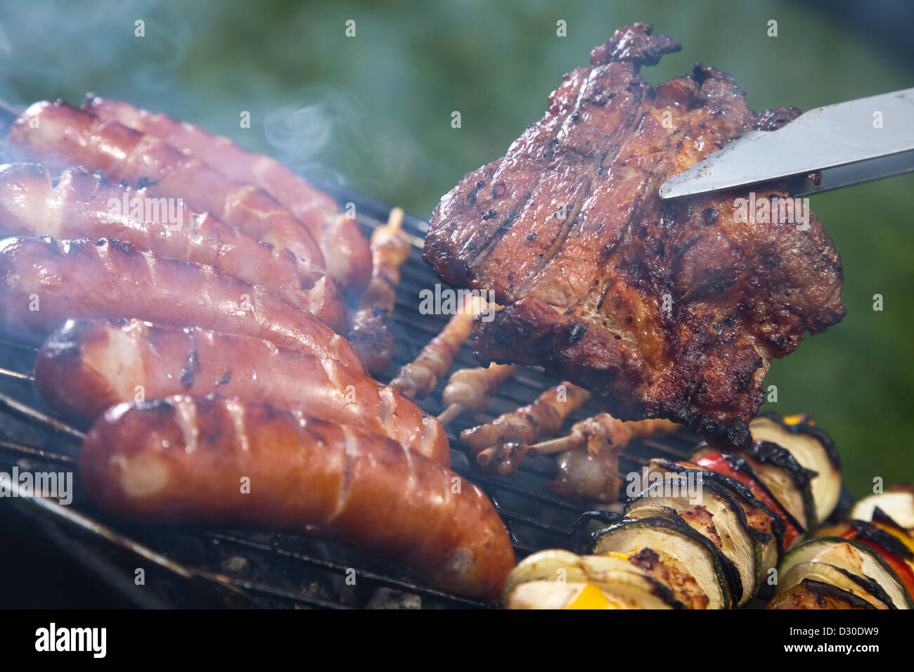 Cooking on the barbecue grill Stock Photo - Alamy