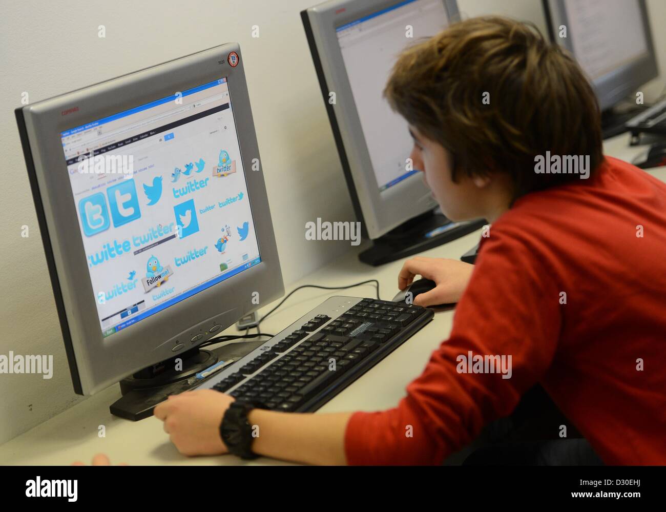 (ILLUSTRATION) An illustration shows a youth sitting behind a computer ...