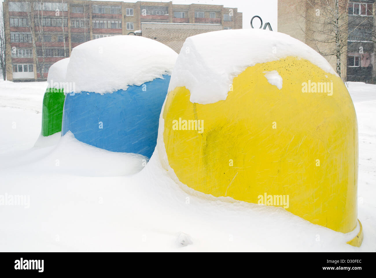 colorful recycling waste containers bins near flat block houses and ...