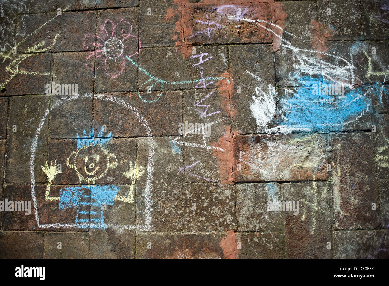 Child drawing above the ground Stock Photo - Alamy