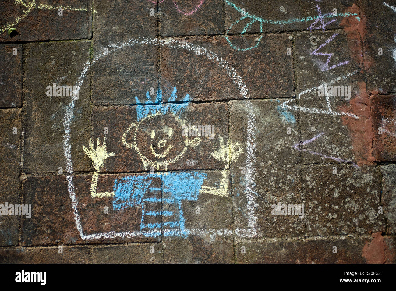 Child drawing above the ground Stock Photo - Alamy