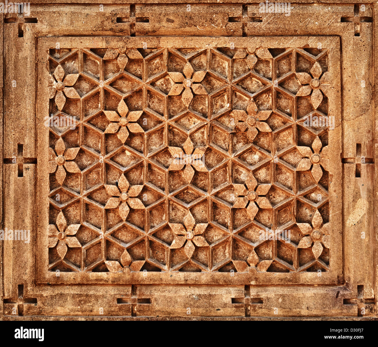 Floral ornament on orange limestone stone wall in Jaisalmer, Rajasthan ...