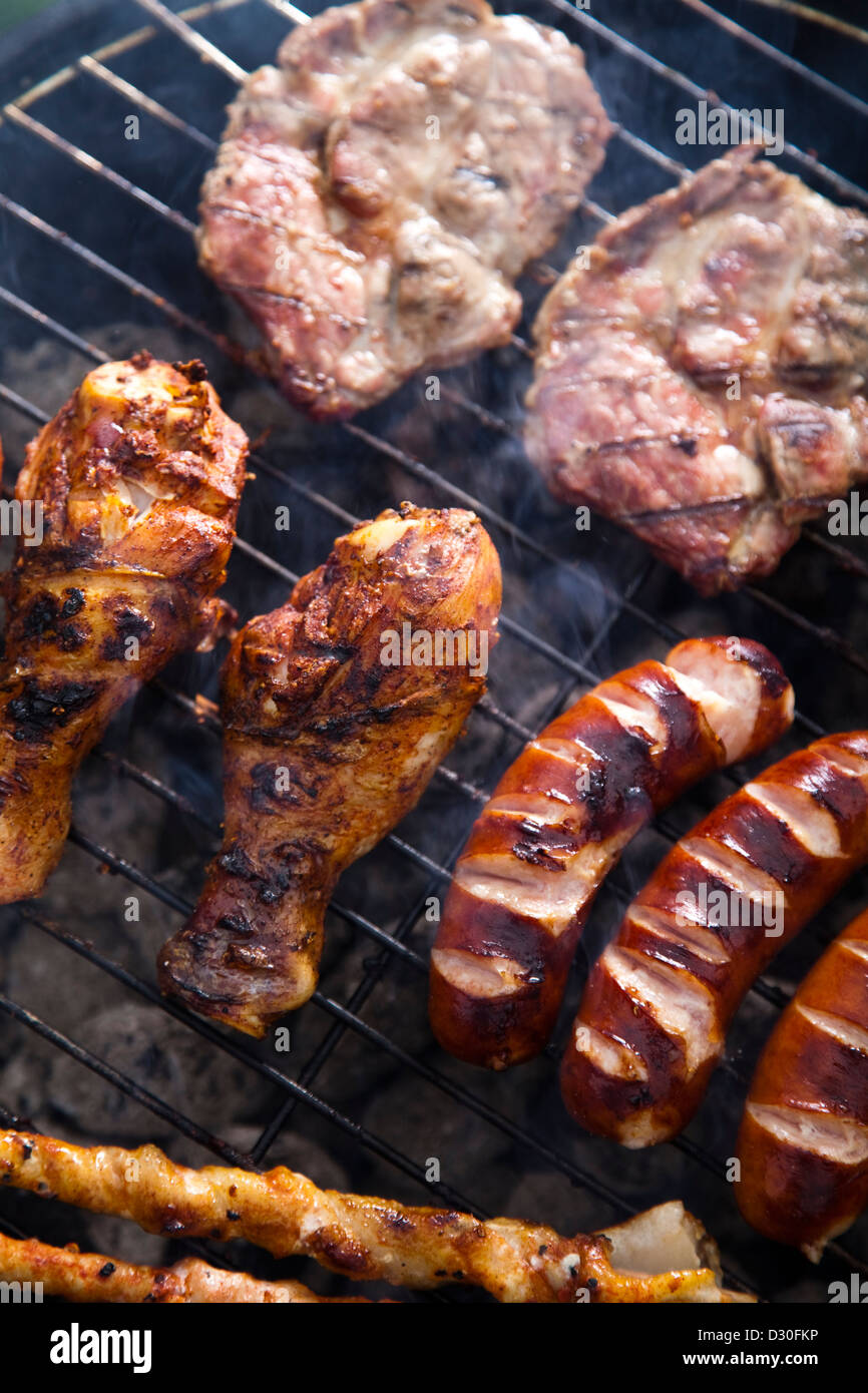 Cooking on the barbecue grill Stock Photo - Alamy