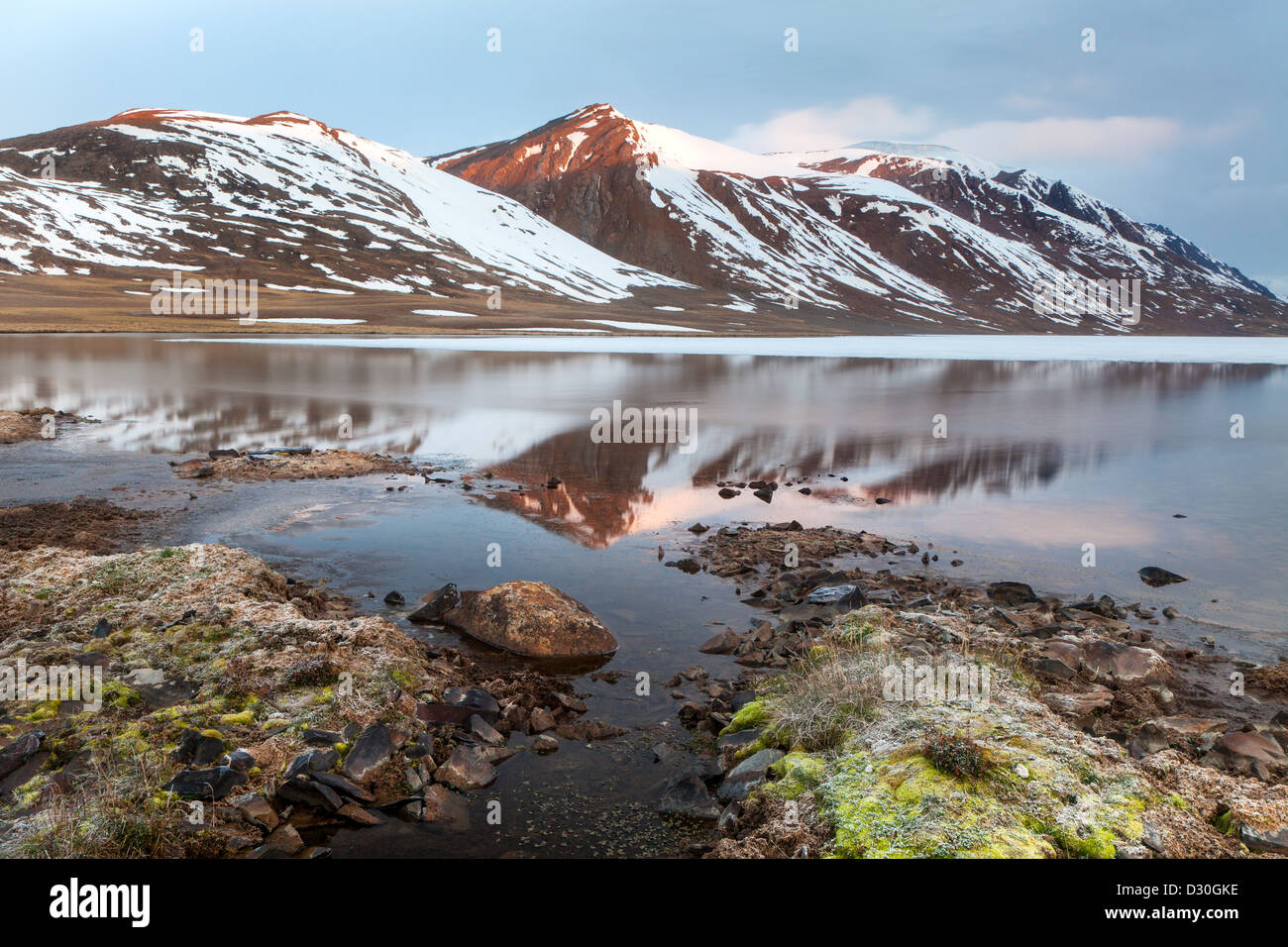 View of mountains reflecting on a lake Stock Photo - Alamy