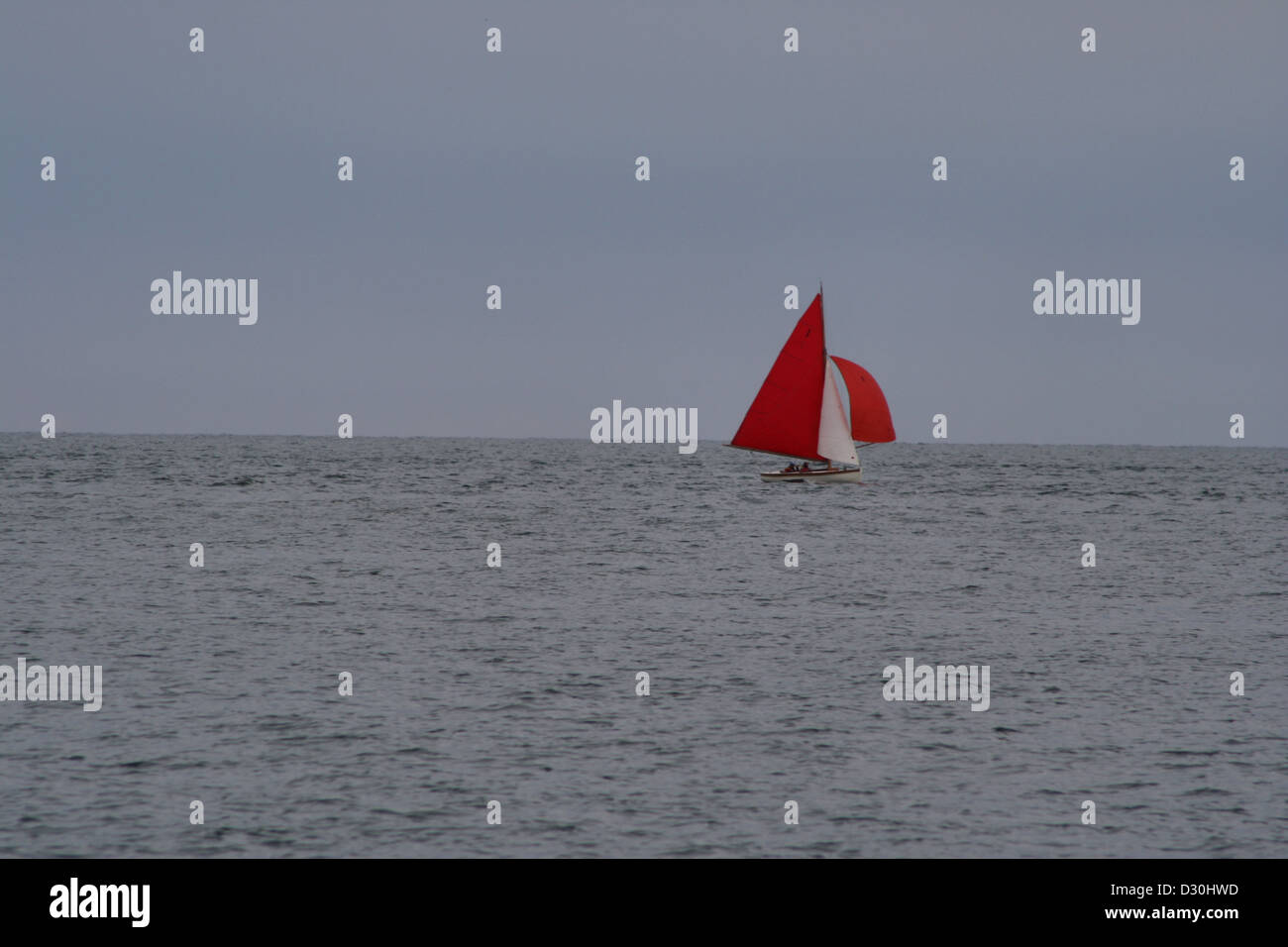 Lone yacht sailing off hi-res stock photography and images - Alamy