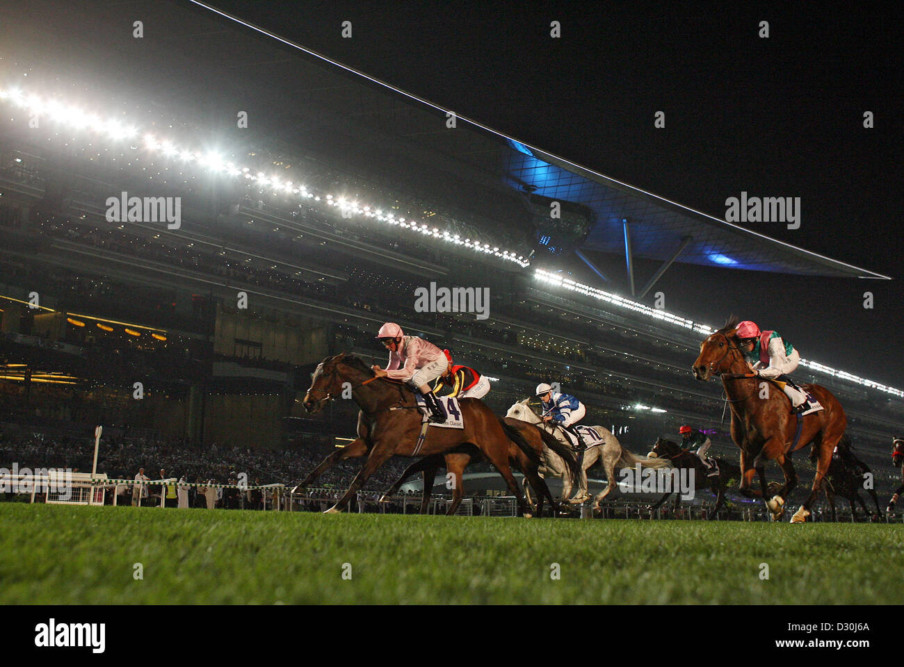 Dubai, United Arab Emirates, horses and jockeys on the racecourse ...