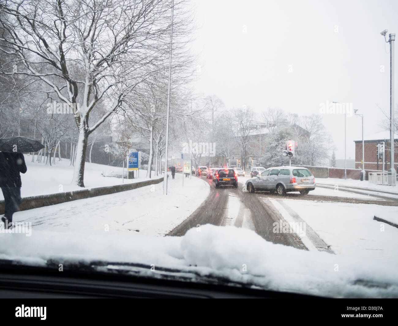 Cars stuck in snow storm during bad weather causing traffic chaos in ...