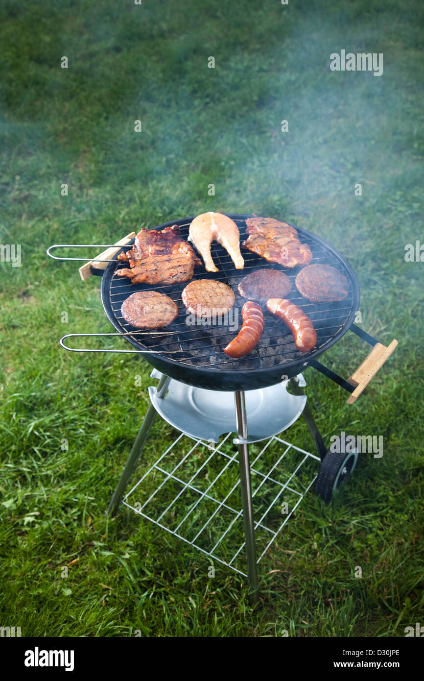Cooking on the barbecue grill Stock Photo - Alamy