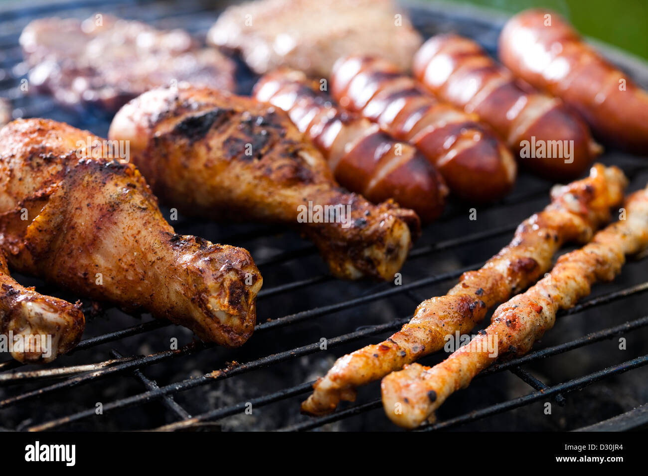 Cooking on the barbecue grill Stock Photo - Alamy