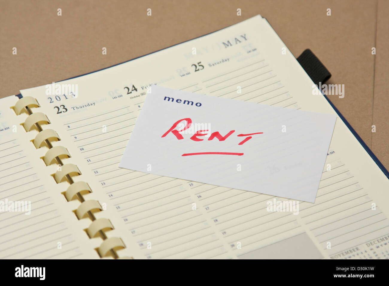 Diary with handwritten reminder to pay rent Stock Photo - Alamy
