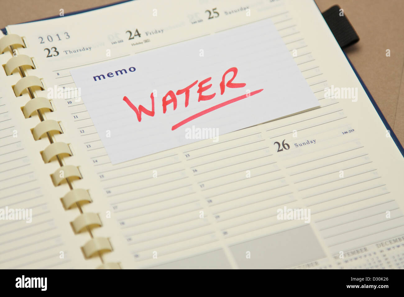Diary with handwritten reminder to pay water rates Stock Photo - Alamy