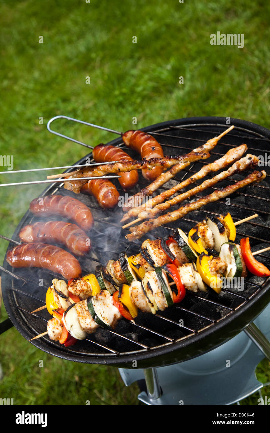 Cooking on the barbecue grill Stock Photo - Alamy