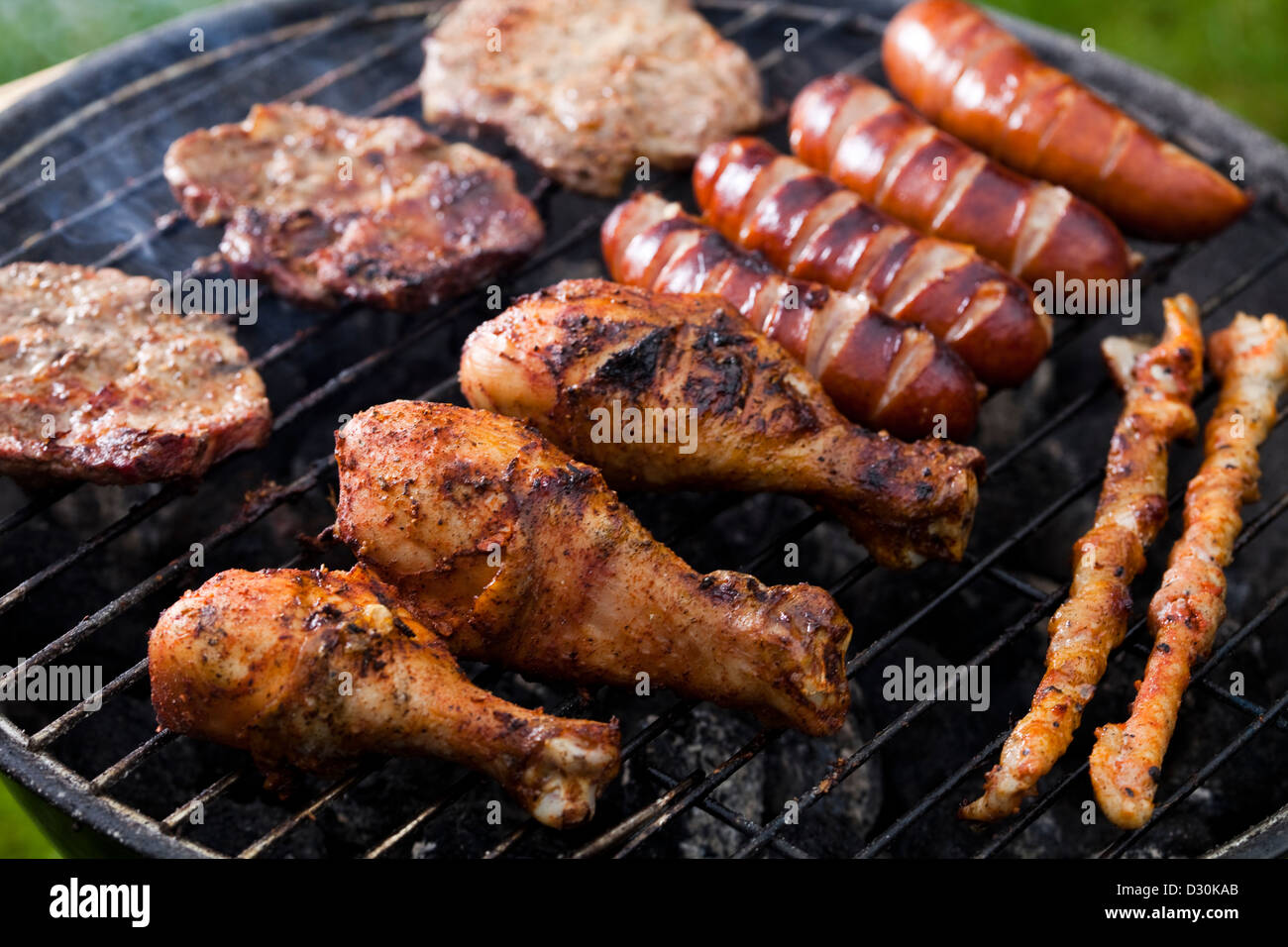 Cooking on the barbecue grill Stock Photo - Alamy