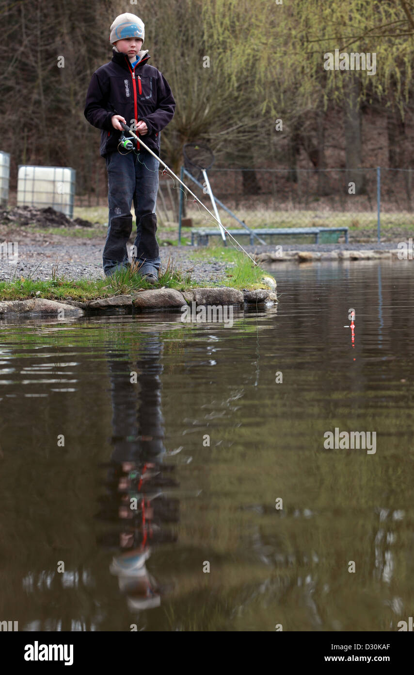 Koenigsberg, Germany, boy fishing at a pond Stock Photo - Alamy