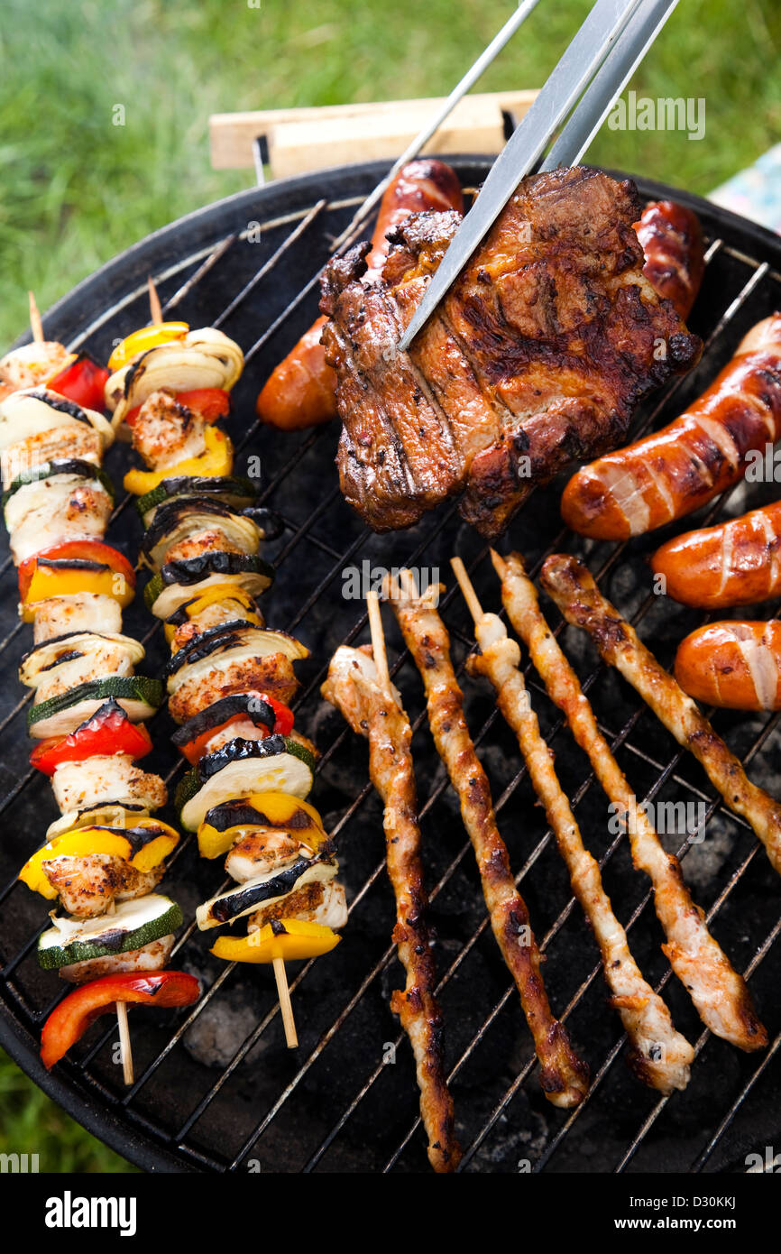 Cooking on the barbecue grill Stock Photo - Alamy