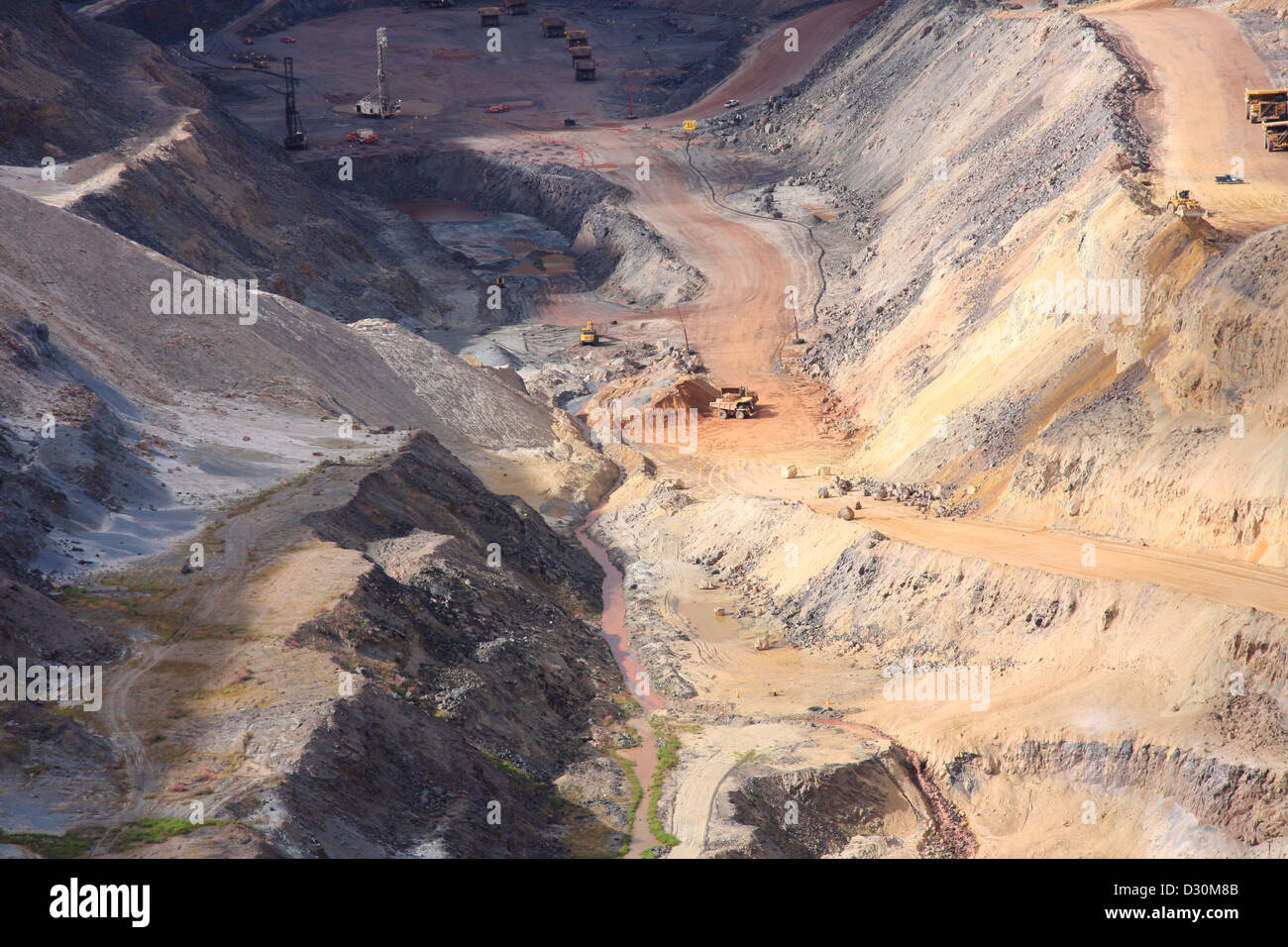 Huge trucks in the biggest Canadian open pit iron mine in Fort Wright ...