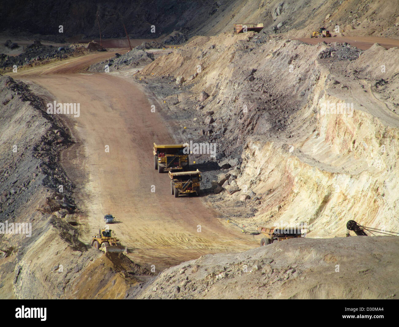 Huge trucks in the biggest Canadian open pit iron mine in Fort Wright ...