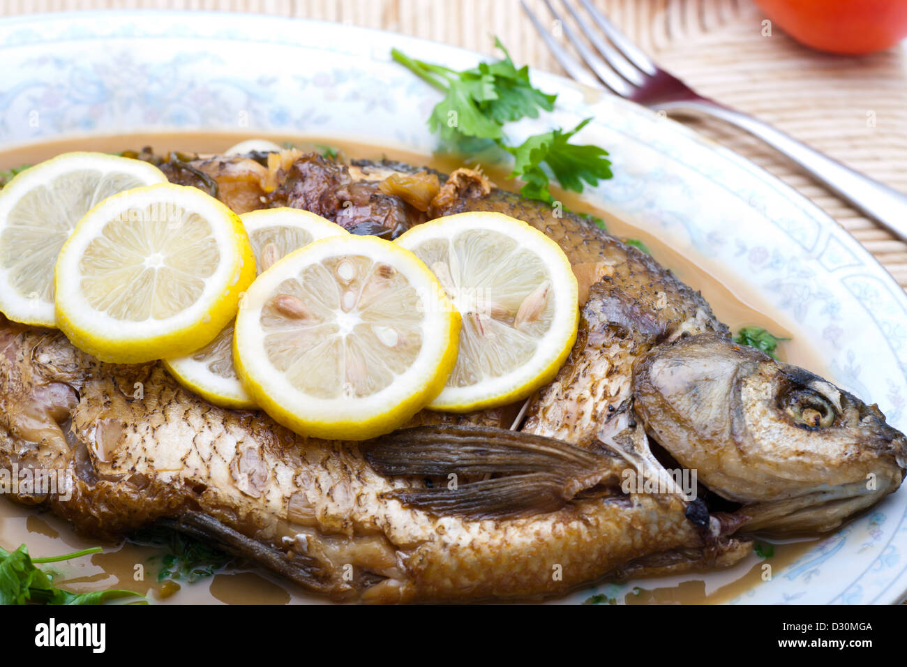 Cooked fish ready for eating - China food style Stock Photo - Alamy