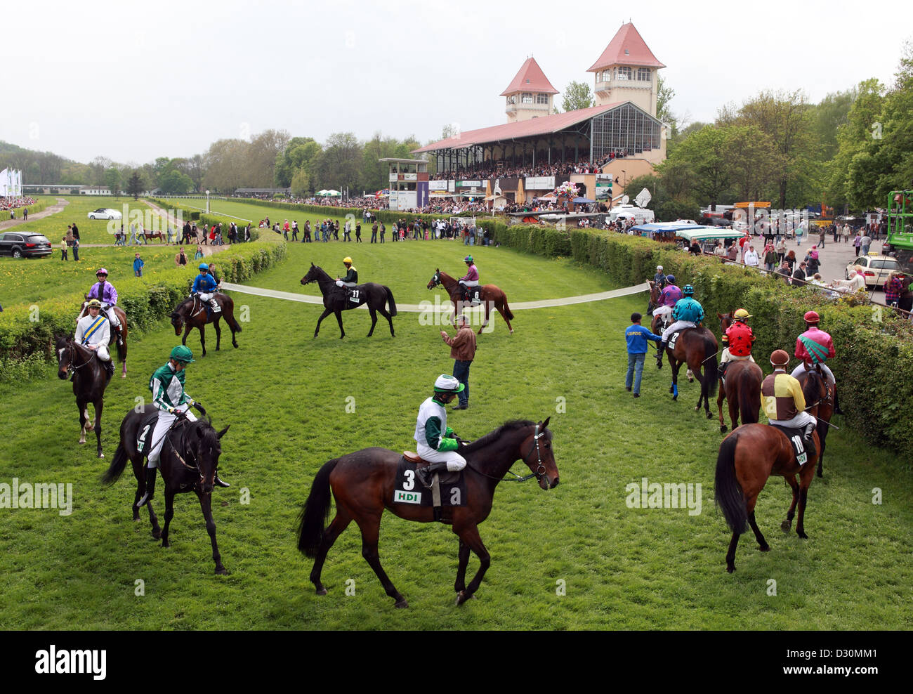 Leipzig, Germany, horses and jockeys in front of the grandstand the ...