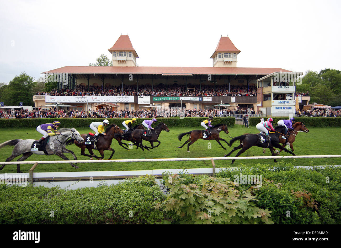 Leipzig, Germany, horses and jockeys in front of the grandstand the ...