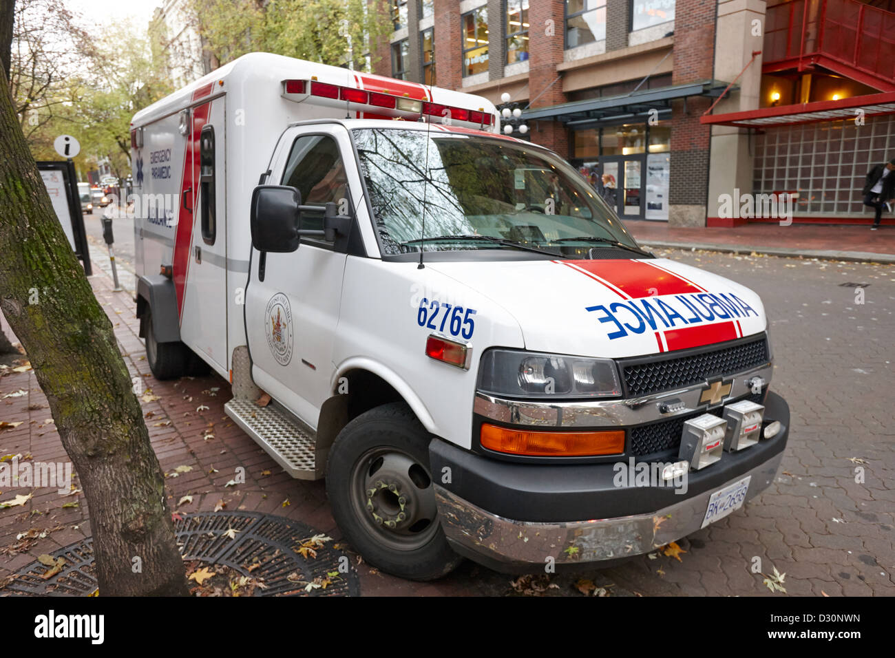 emergency paramedic ambulance parked on the side of a street in ...
