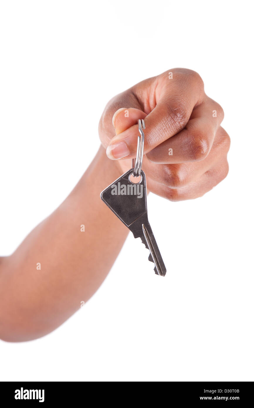 African American woman Hand Holding a house key, isolated on white ...