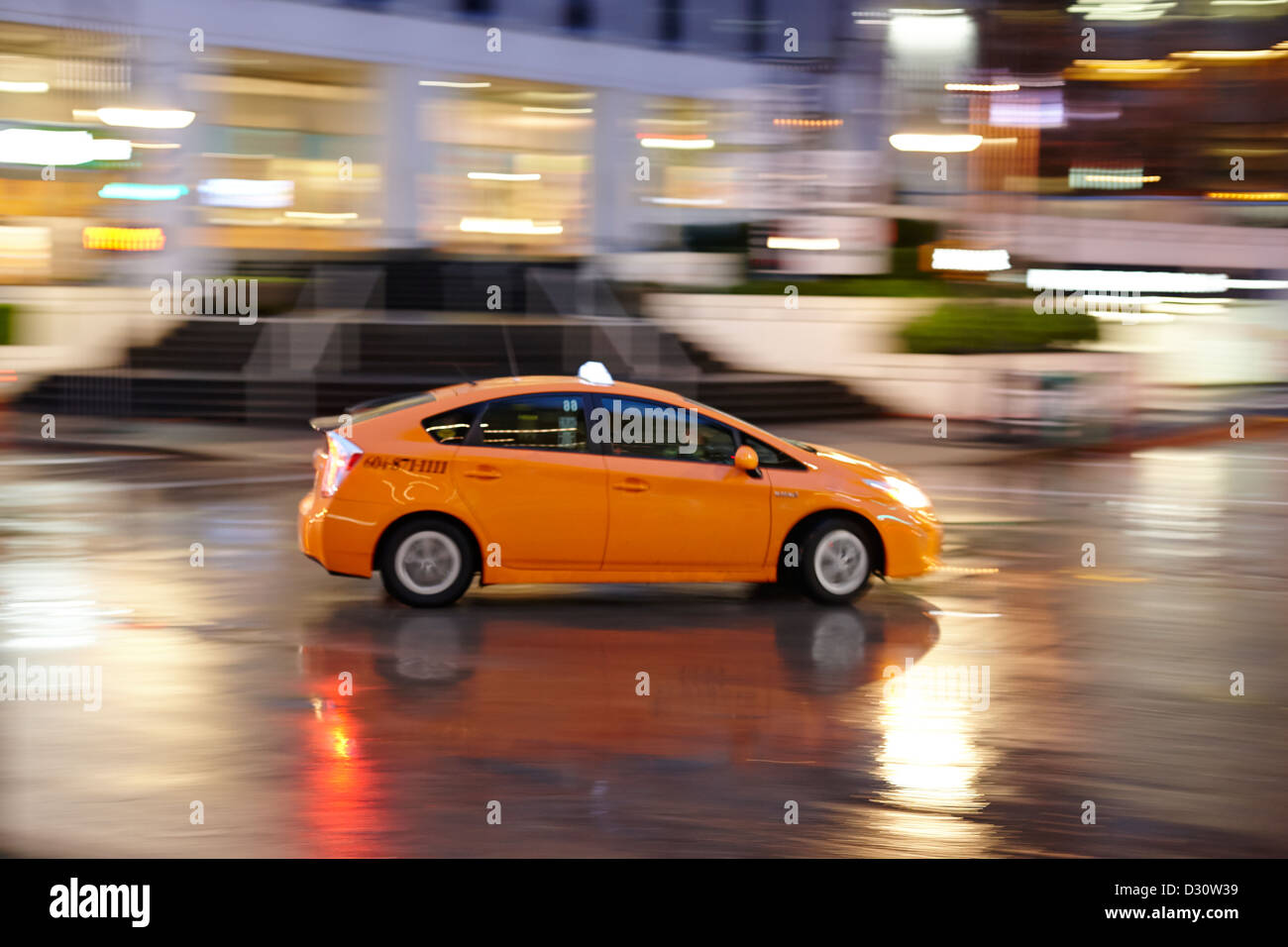 yellow cab taxi downtown Vancouver city at night BC Canada deliberate ...