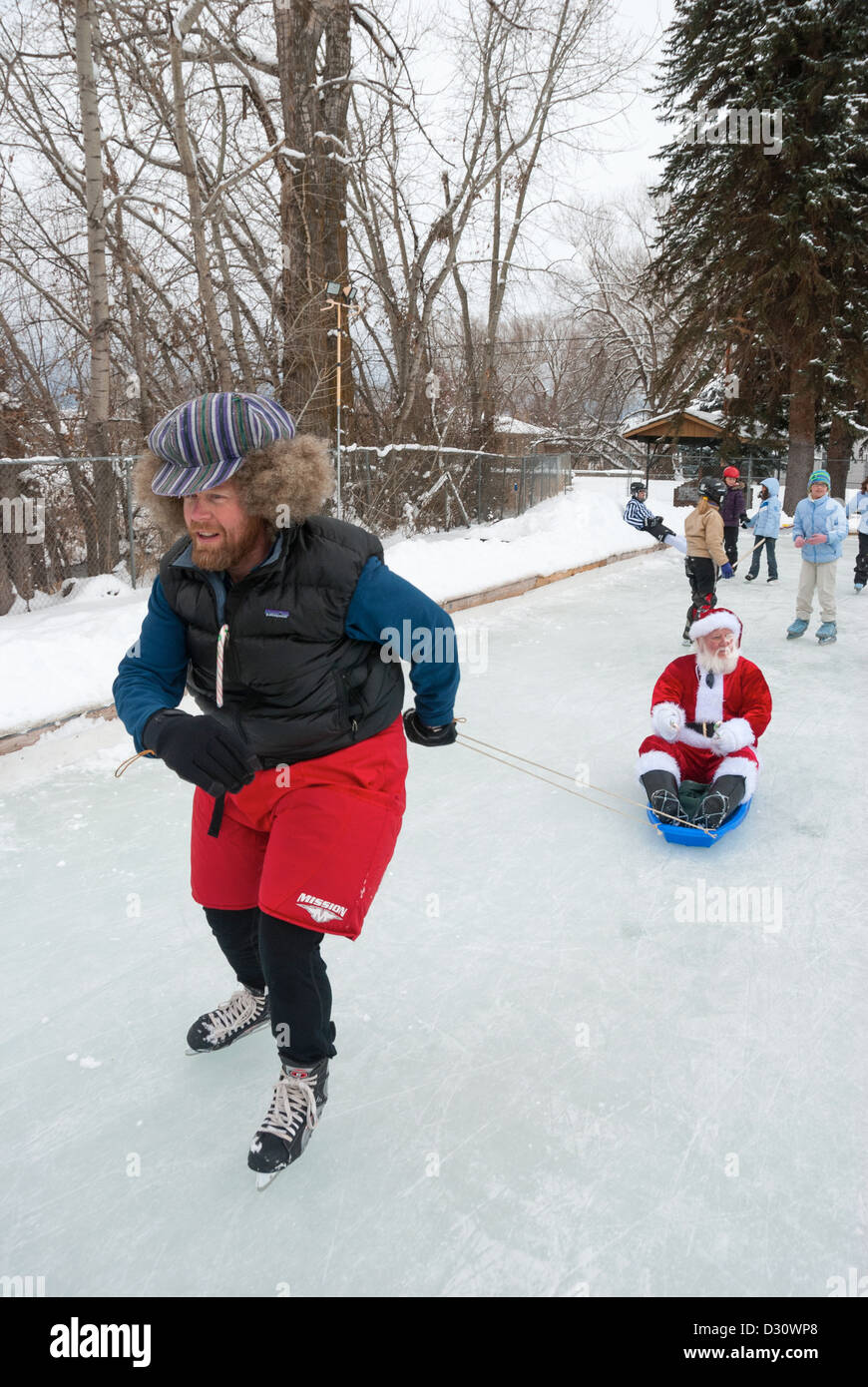 Ice skating rink and santa claus hi-res stock photography and images ...