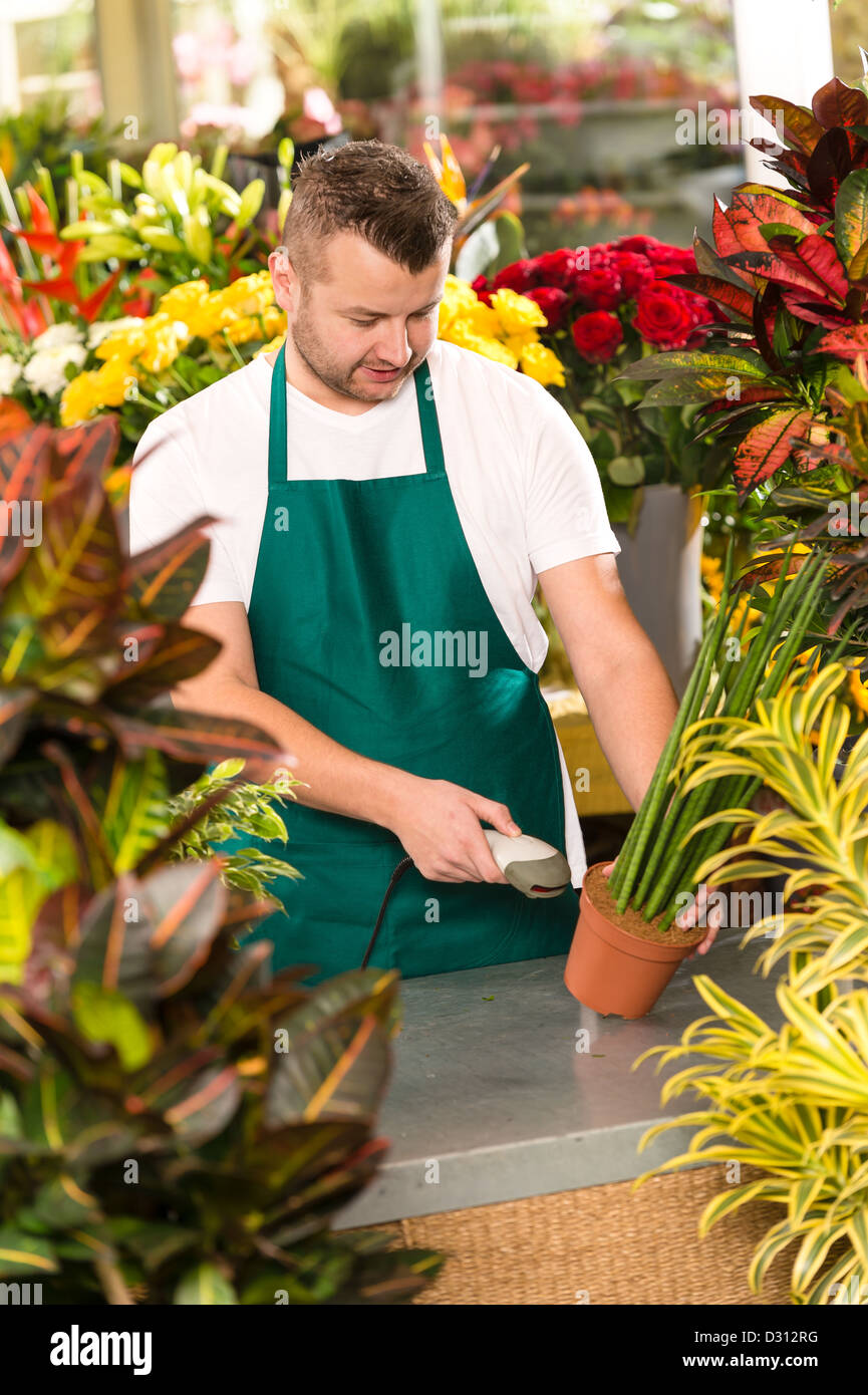 Florist man reading barcode potted plant shop market flower Stock Photo ...
