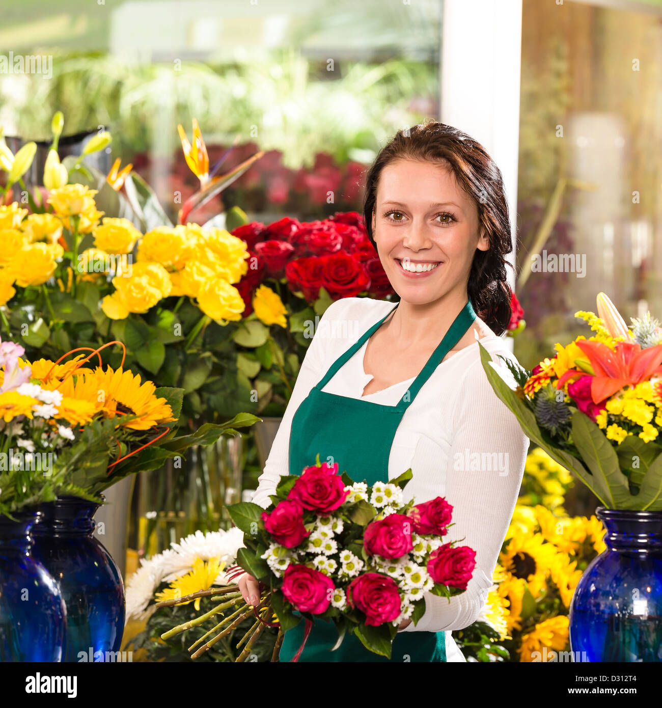 Cheerful female florist bouquet roses flower shop posing owner Stock ...