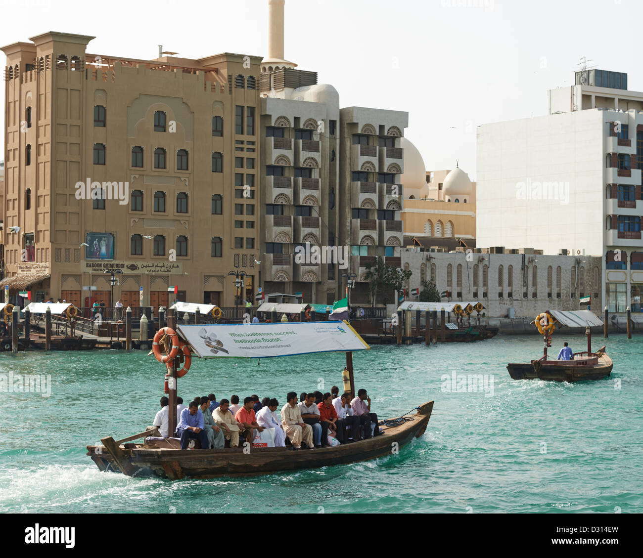 Compact wooden ferry boats shuttle passengers down the Dubai Creek ...