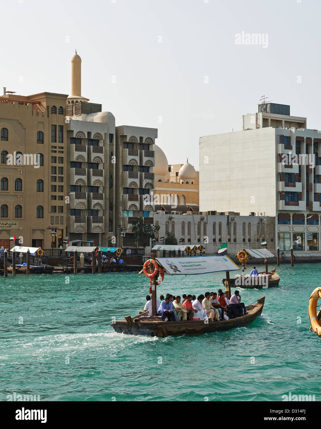 Compact wooden ferry boats shuttle passengers down the Dubai Creek ...