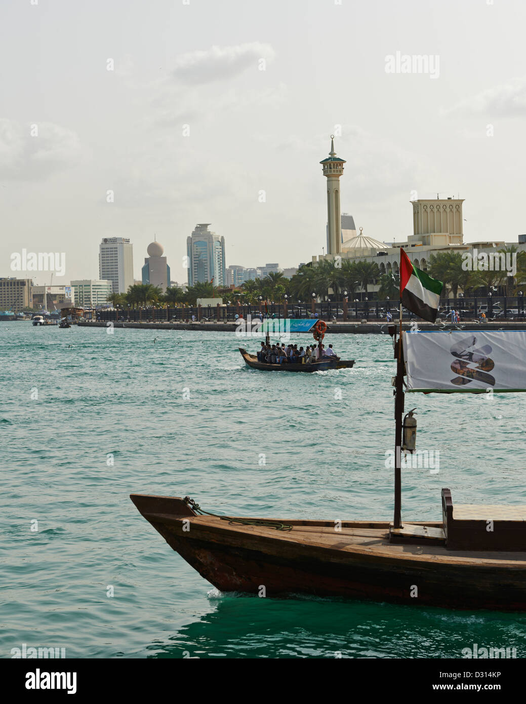 Compact wooden ferry boats shuttle passengers down the Dubai Creek ...