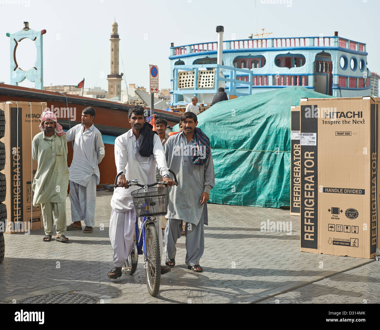 A group of Dubai men pose at a shipping dock Stock Photo - Alamy