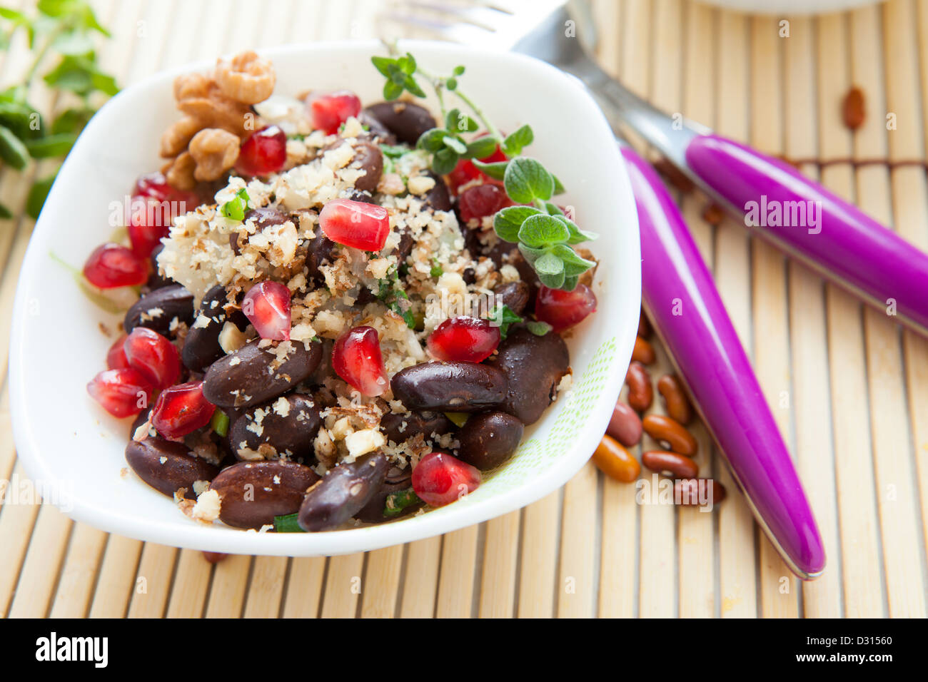Boiled beans with walnut sauce,closeup Stock Photo - Alamy